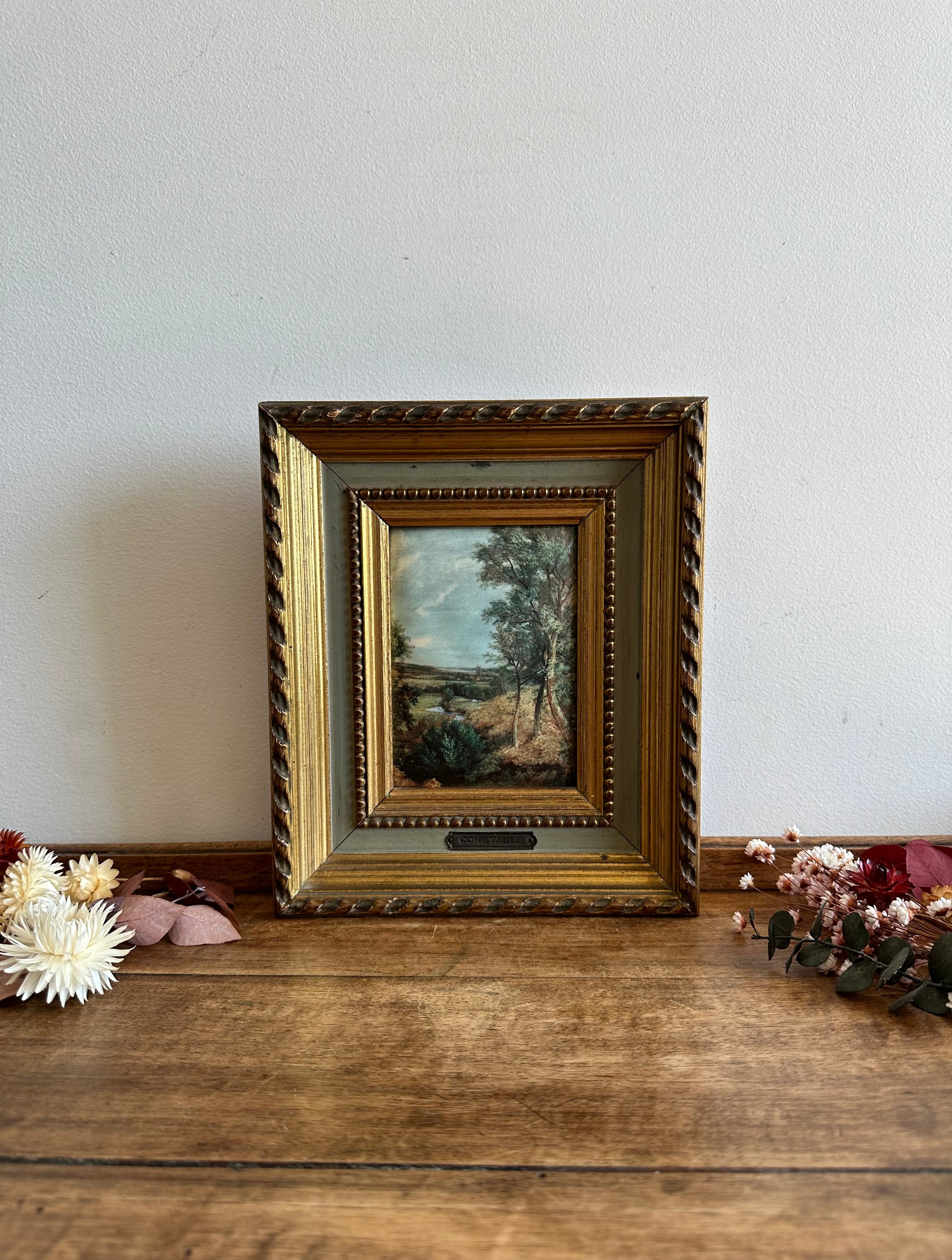 Plaque Helca émaillée encadrement doré à la feuille. | Ma Cabane Vintage